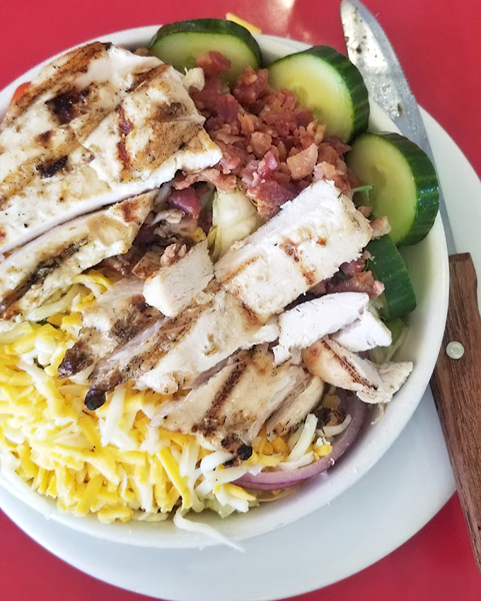 When a salad looks this good, even dedicated carnivores might consider switching teams—at least until the bacon bits remind them who they really are.
