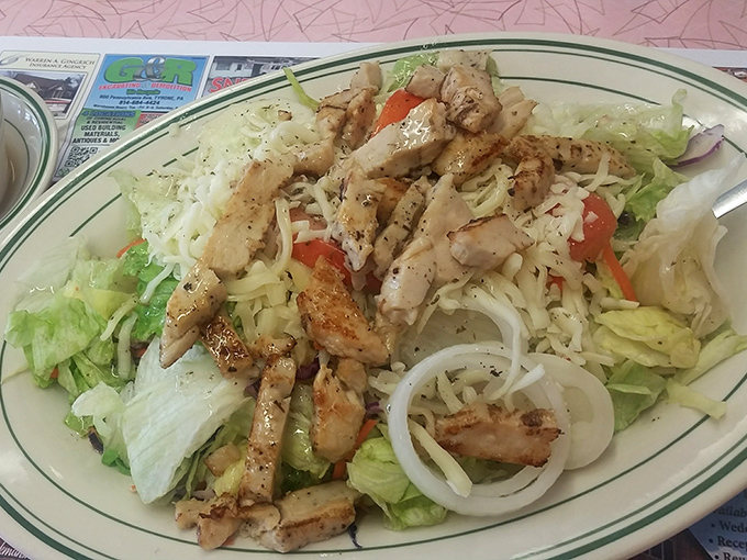A grilled chicken salad that actually satisfies. No sad desk lunch here&mdash;just perfectly seasoned chicken atop crisp lettuce that doesn't apologize for being healthy.