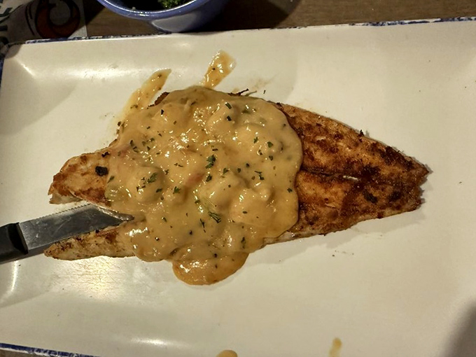 That grilled fish is having its best day, topped with a sauce that means business.