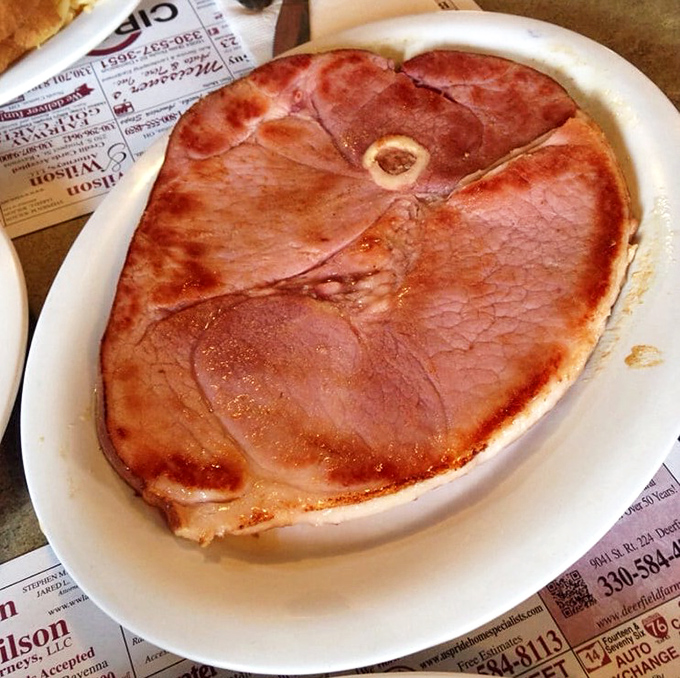 A ham steak that commands its own zip code, served with the confidence of someone who knows what comfort food should be.