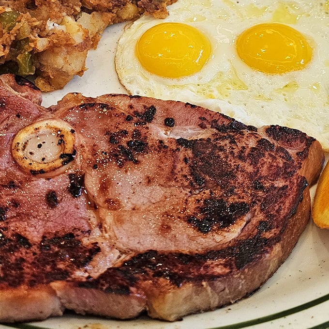 When ham steak means business. Perfectly seared, substantial, and paired with sunny-side-up eggs that practically high-five your taste buds.