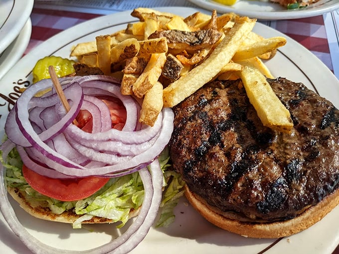 This isn't just a burger—it's an architectural achievement with layers of beef, fresh vegetables, and a bun that somehow defies the laws of structural engineering.