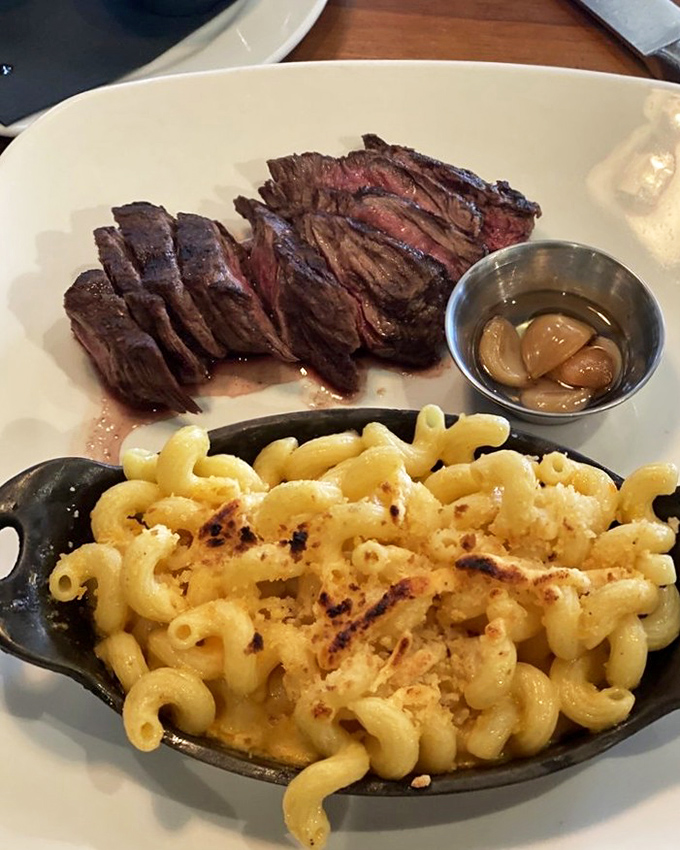 Sliced hanger steak with mac and cheese that's been kissed by fire&mdash;comfort food that got dressed up but didn't lose its soul. 