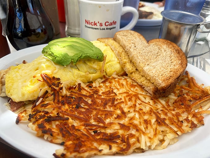 Golden hash browns with the perfect crisp-to-tender ratio, alongside an omelet and avocado&mdash;the breakfast holy trinity of Los Angeles.