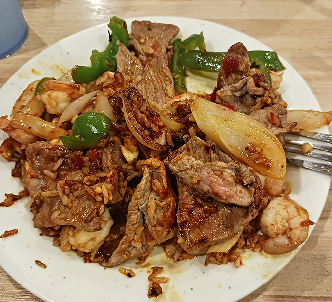 The hibachi chef's masterpiece &ndash; a sizzling symphony of beef, shrimp, and vegetables that makes you wonder why you ever bothered with frozen stir-fry at home.