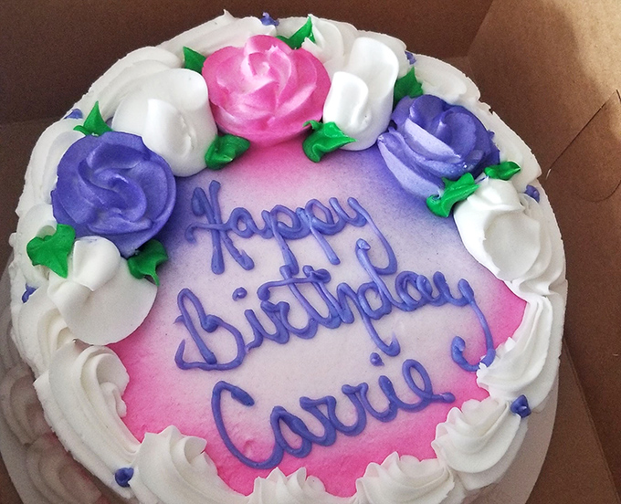 This birthday cake isn't just dessert; it's a pink and purple celebration centerpiece that makes candles and wishes feel like supporting actors.