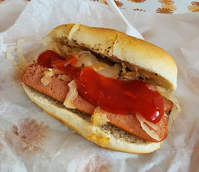 The hot dog&mdash;dressed with sauerkraut and a confident streak of ketchup&mdash;proves that sometimes the simplest pleasures are the most enduring. A handheld slice of Americana.