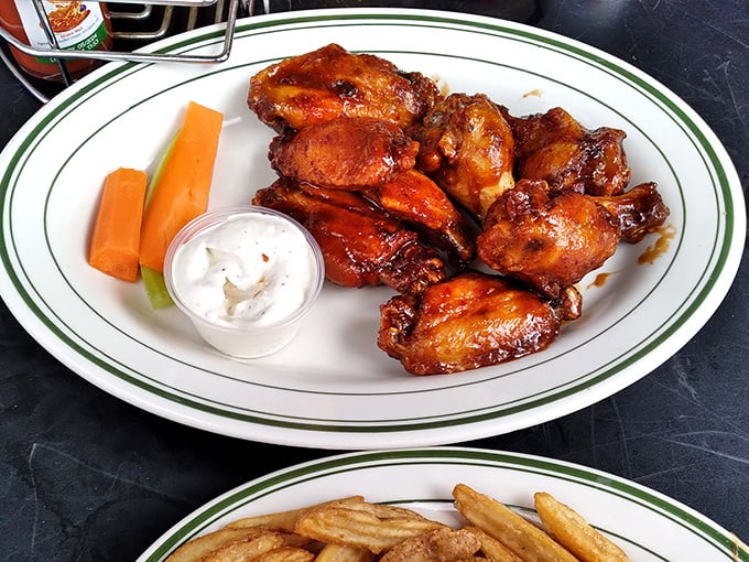 Wings glazed to glossy perfection, accompanied by cooling ranch and crisp carrots &ndash; a holy trinity of bar food excellence.