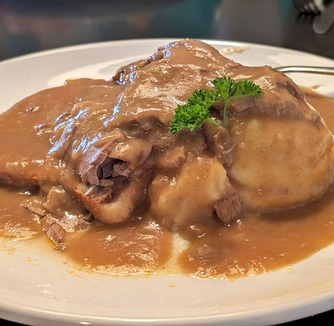 Brisket so tender it practically surrenders to your fork, swimming in gravy that deserves its own fan club.