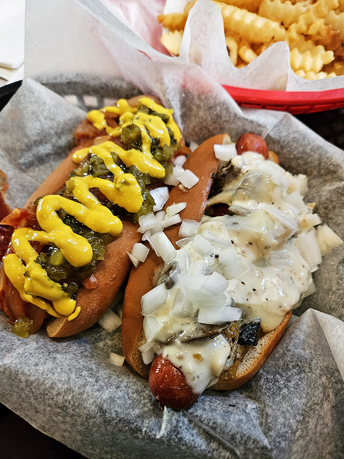 Two hot dogs dressed to impress, proving that simple ingredients can create extraordinary flavor combinations together.