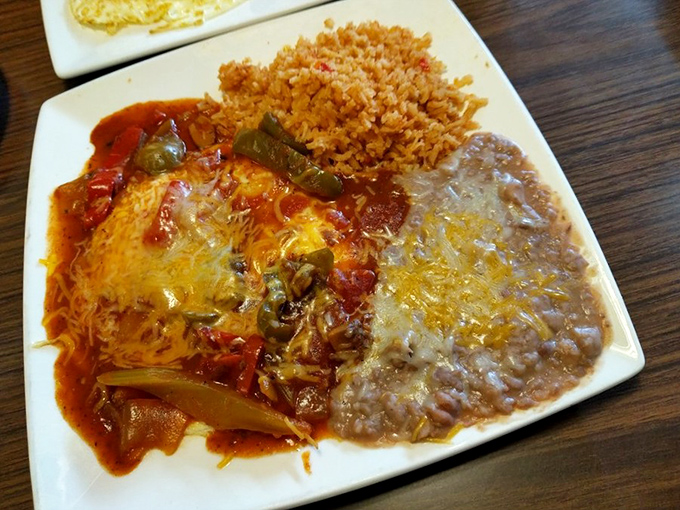 Mexican breakfast perfection: rice, beans, and something smothered in melted cheese that's calling your name across the restaurant.