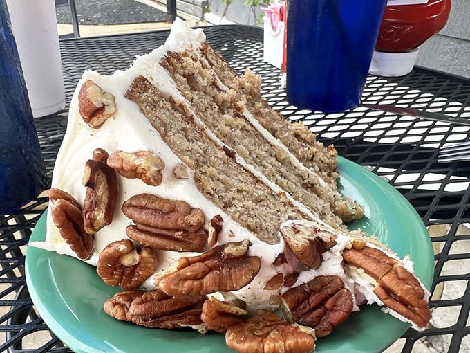 A slice of hummingbird cake that doesn't fly away but instead lands perfectly on your fork, complete with pecans that add just the right crunch.