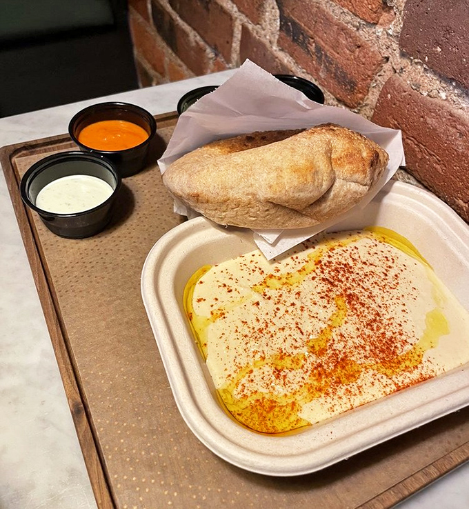 This hummus plate is the silky, smooth diplomat that brings warring taste buds to peaceful agreement. That drizzle of olive oil is liquid gold.
