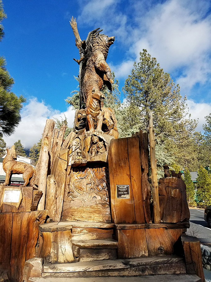 Wood carving elevated to an art form. This towering sculpture tells forest stories in cedar&mdash;like a totem pole that graduated from art school.