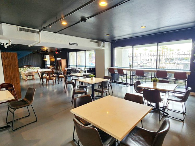 Clean lines, modern seating, and natural light create a coffee shop experience that makes you forget you're technically in a thrift store.