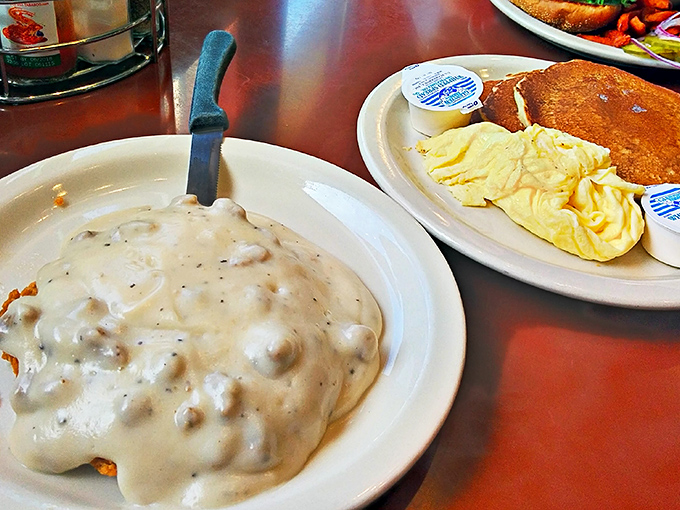 Biscuits and gravy so generously portioned you'll need a snorkel to reach the bottom. This plate doesn't just feed you&mdash;it hugs your soul.