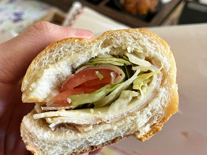 The Italian hoagie cross-section reveals the geological layers of deliciousness—a sandwich archeologist's dream discovery.