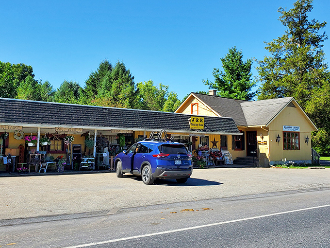 J&R Country Store's sunny yellow facade promises the kind of shopping experience where "browsing" turns into "how will I fit this in my car?"