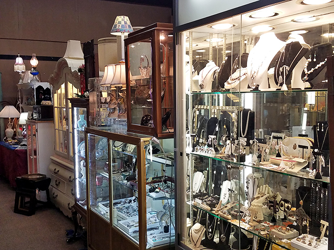 Gleaming display cases house vintage jewelry and collectibles, each piece whispering stories of formal dances and special occasions past.