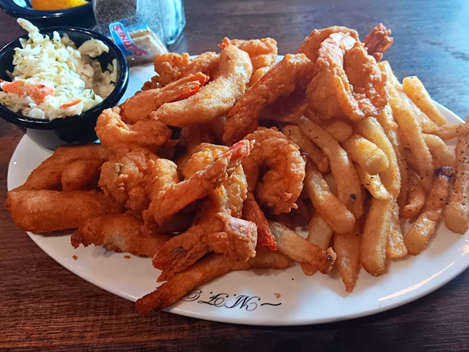 These jumbo shrimp defy their oxymoronic name, fried to crispy perfection and served with fries and coleslaw for the ultimate comfort meal.