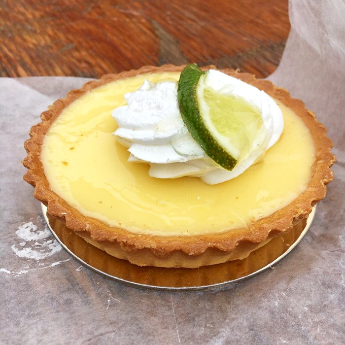 A key lime tart that strikes the perfect balance between sweet and tart. That dollop of whipped cream and lime slice? The exclamation point on a perfect sentence.