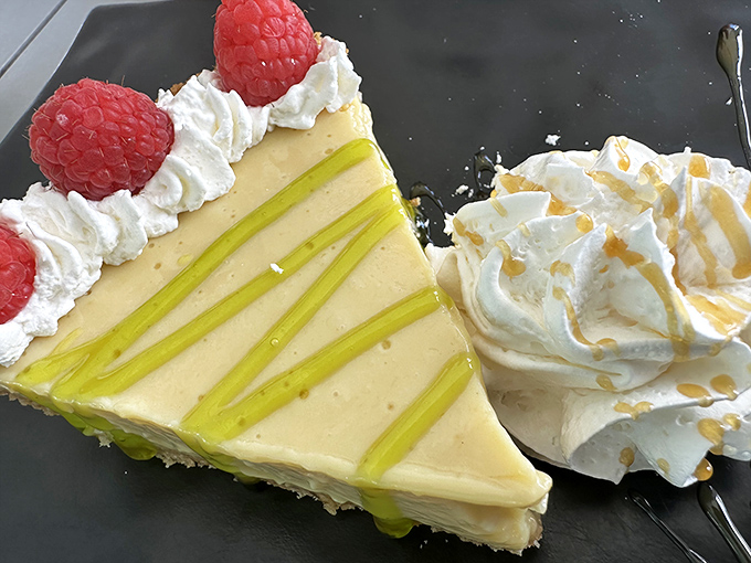 Key lime pie that strikes the perfect balance between sweet and tart, topped with raspberries that add just the right pop of color and flavor.
