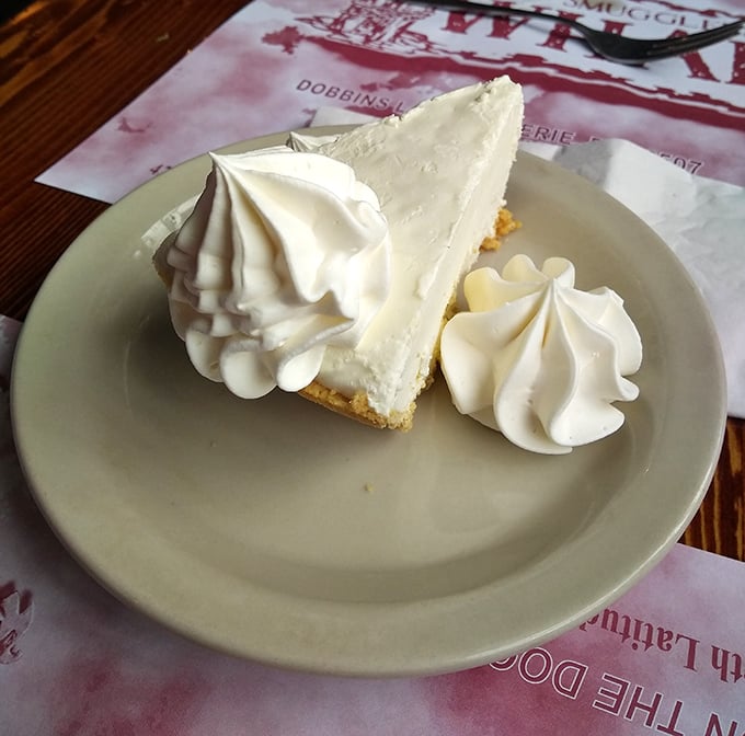 Key lime pie so authentic it should come with a Florida passport. Those dollops of whipped cream aren't just garnish—they're exclamation points.