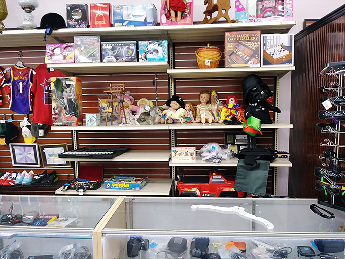 One shopper's outgrown toys become another child's treasure in this nostalgic corner where Darth Vader might sit beside vintage board games.