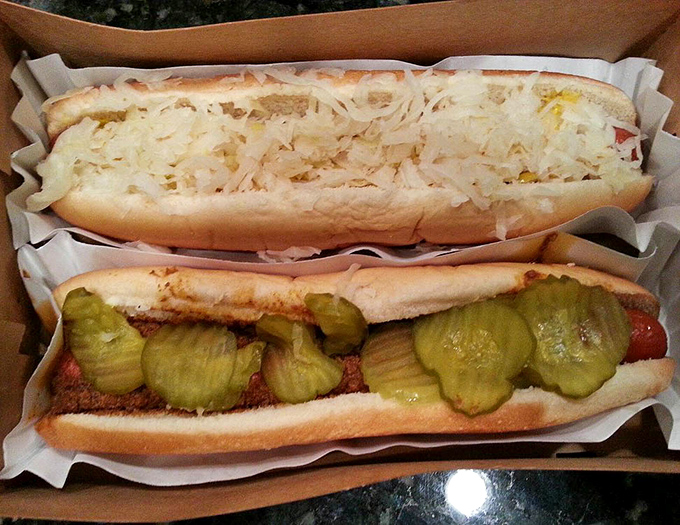 The dynamic duo: one topped with tangy sauerkraut, another with homemade chili and pickles&mdash;proof that hot dogs are nature's perfect canvas.