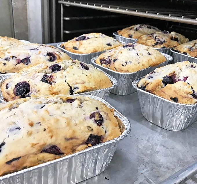 Fresh-baked blueberry breads cooling in their tins&mdash;the baker's version of a family portrait. Each one uniquely beautiful, equally tempting.