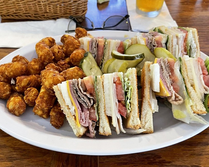 The club sandwich that puts all others to shame&mdash;triple-decker architecture with layers of meat, cheese, and veggies alongside golden tater tots.