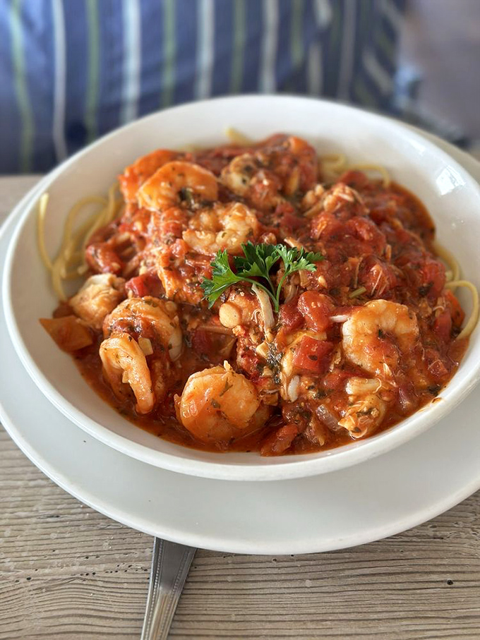 Shrimp linguine that would make an Italian grandmother nod in approval—each plump crustacean bathing in a tomato sauce worth bottling and taking home.