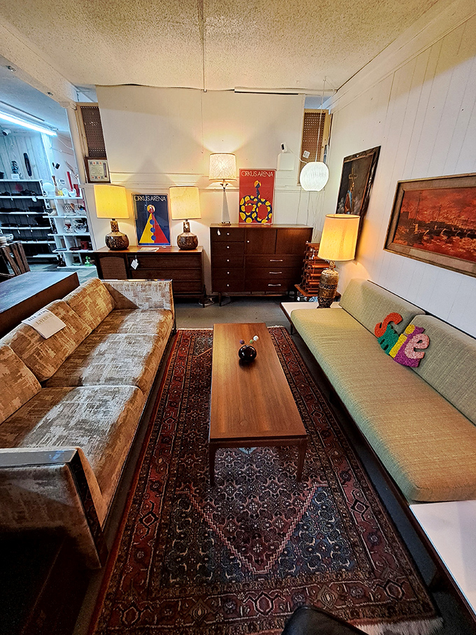 Mid-century modern heaven with matching sofas that would make Don Draper nod in approval. That coffee table has stories to tell.