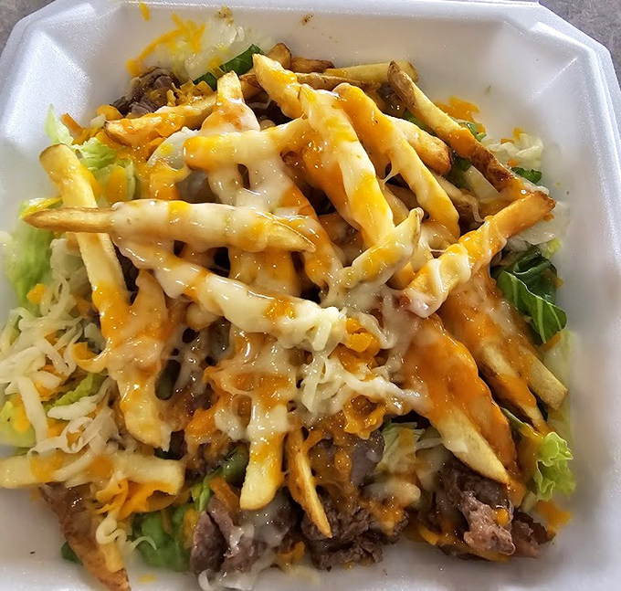 These loaded fries are what happens when potatoes fulfill their highest calling&mdash;smothered in cheese, meat, and enough toppings to qualify as a complete meal.