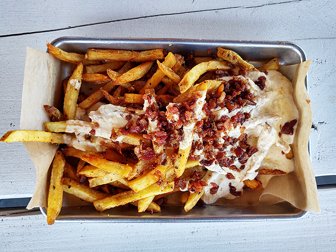 These loaded fries aren't just a side &ndash; they're a main event dressed in bacon bits and cheese sauce, waiting to steal the spotlight from your entr&eacute;e.
