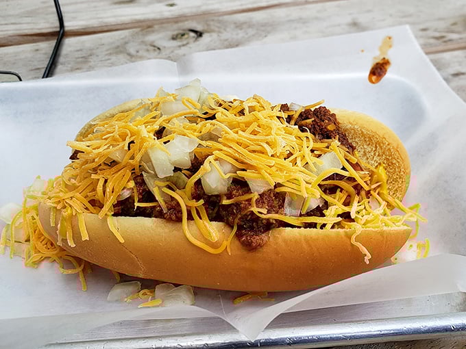 This isn't just a chili dog&mdash;it's comfort food architecture with layers of beef, cheese, and childhood memories in every bite.