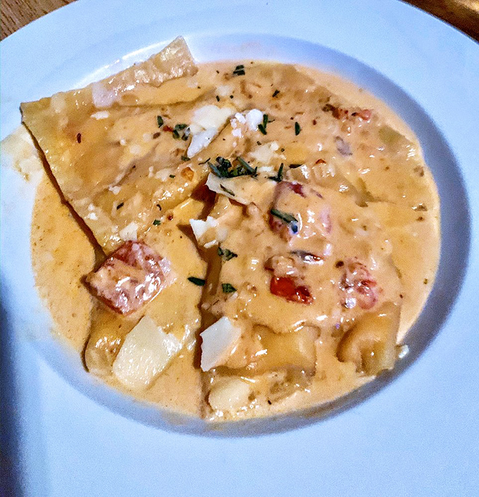 Seafood ravioli swimming in a sauce so good you'll want to bottle it. Those tender pasta pillows are stuffed with maritime treasures!