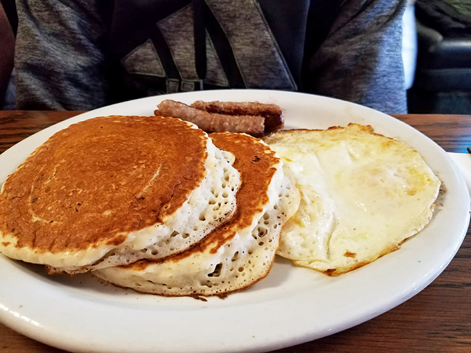 The classic American breakfast in its natural habitat &ndash; pancakes with the ideal golden hue, eggs with perfect runny yolks, and a side of nostalgia.