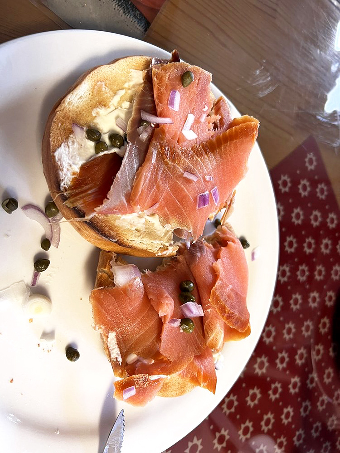 This isn't just a bagel with lox &ndash; it's a masterclass in simplicity, where cream cheese, capers, and that house-smoked salmon create perfect harmony on toasted perfection.