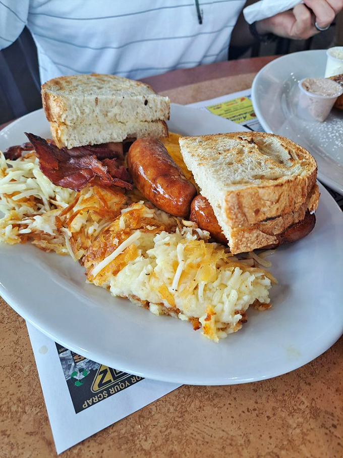 A spinach and cheese omelet that puts your homemade attempts to shame, with toast standing by for essential yolk-sopping duties.