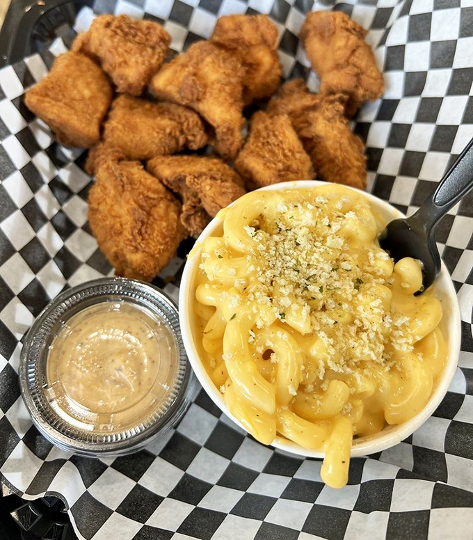 The Nashville Nuggs and mac and cheese combo&mdash;golden-fried nuggets beside a creamy, cheesy masterpiece topped with breadcrumbs that whisper, "Diet tomorrow." 
