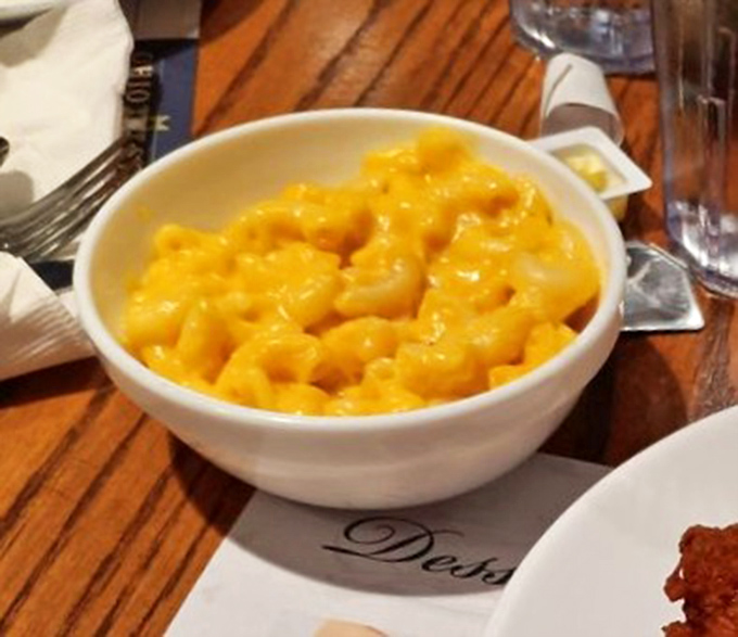 Mac and cheese so gloriously yellow it could guide ships to shore. Comfort food that requires no passport but delivers a world-class experience.