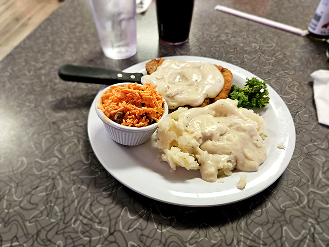 These mashed potatoes aren't just whipped &ndash; they're transformed into cloud-like pillows of comfort, blanketed in gravy that could solve world peace.