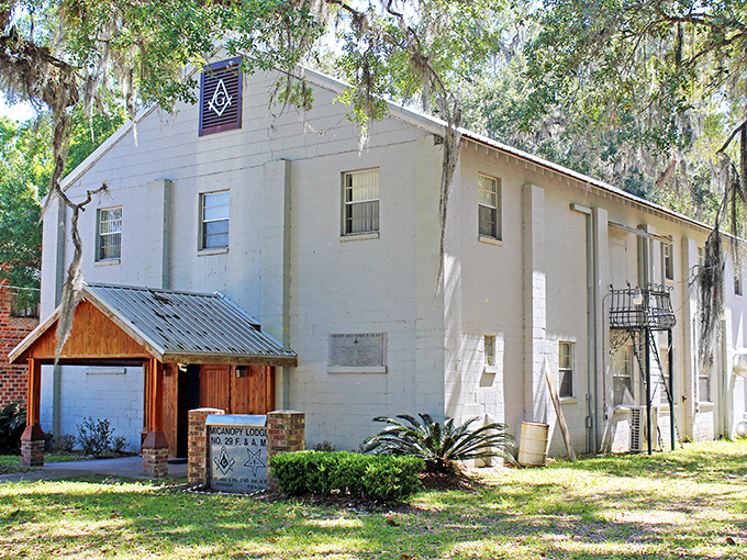 The Masonic Lodge stands as a testament to Micanopy's community roots, its white fa&ccedil;ade and distinctive emblem a landmark for generations of locals.