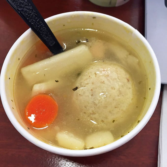 A matzo ball floating in golden broth like the moon in a savory sky. Comfort food that transcends cultural boundaries.