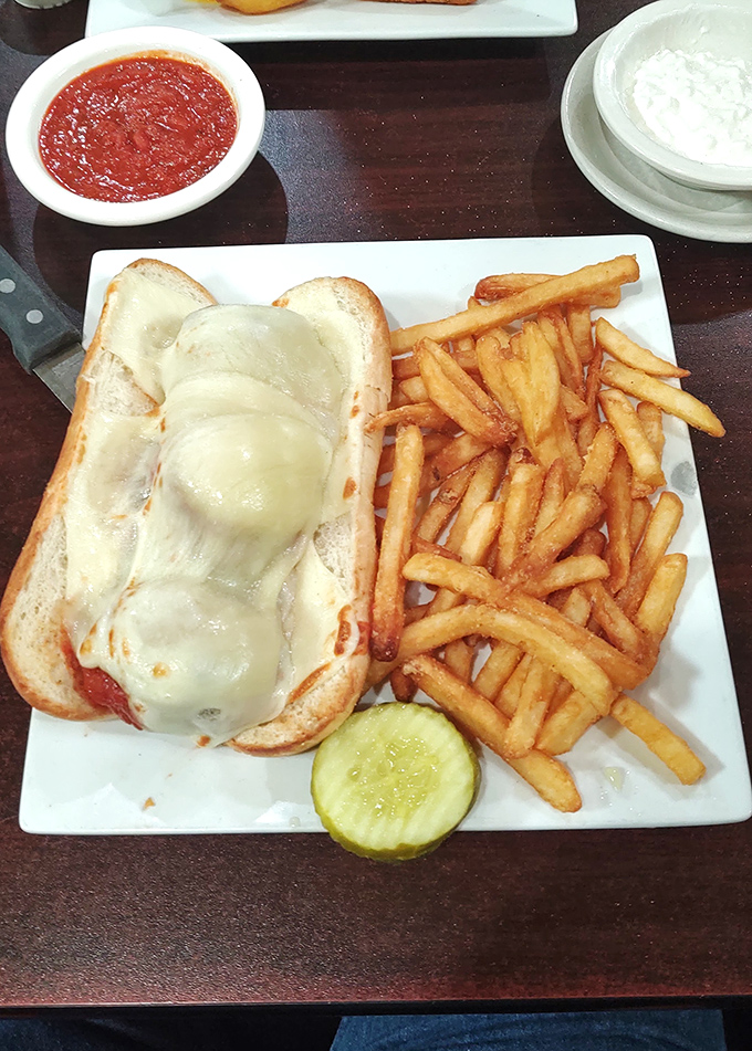 When a sandwich requires both melted cheese AND a pickle spear, you know you're in for something special.