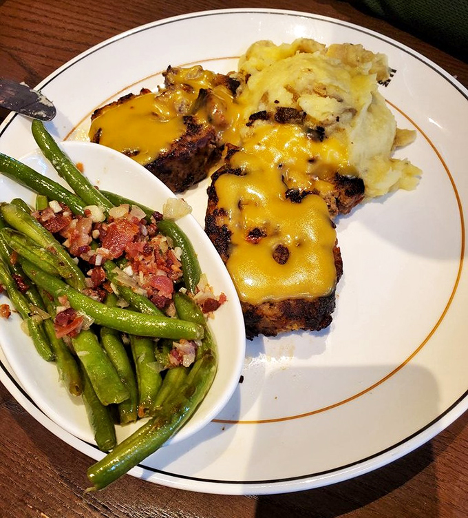 Meatloaf that would make your grandmother simultaneously proud and jealous. Those green beans with bacon bits are the unsung heroes of this plate.
