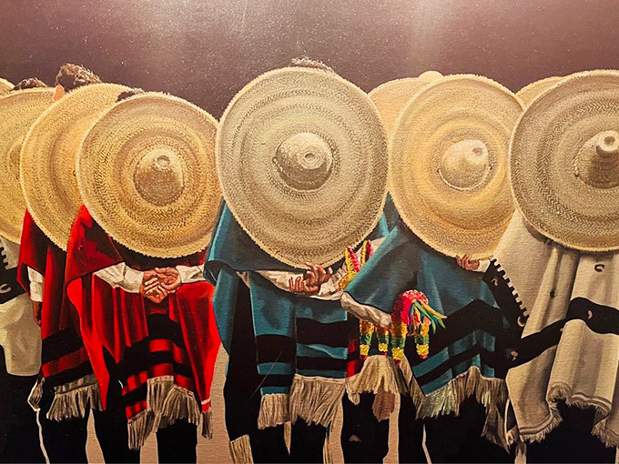 Traditional sombreros line the wall like colorful sentries, adding authentic Mexican charm without crossing into theme park territory.