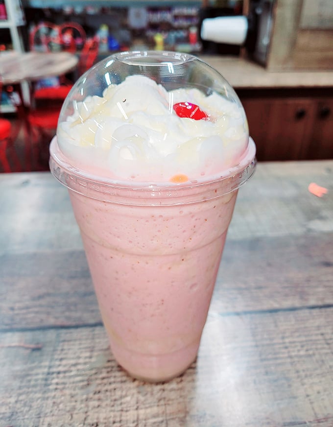This isn't just a milkshake&mdash;it's a pink cloud in a cup topped with enough whipped cream to make a dairy cow blush.
