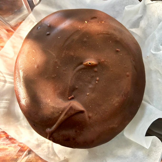 This moon pie isn't just dessert—it's edible nostalgia with a chocolate upgrade. Your childhood just got a glow-up.